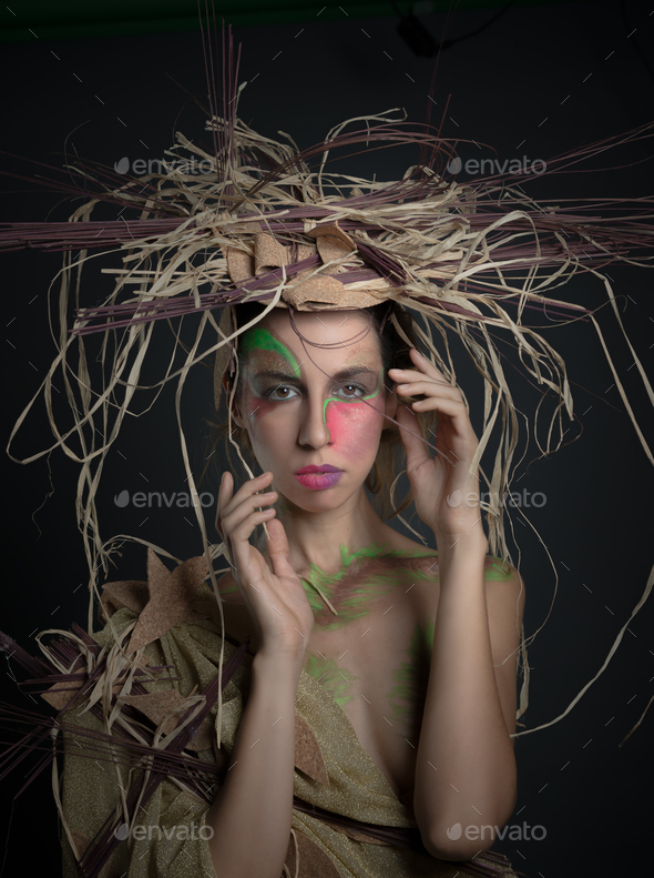 Woman With Wild Look Posing With Colorful Makeup In Fantasy Atmo Stock